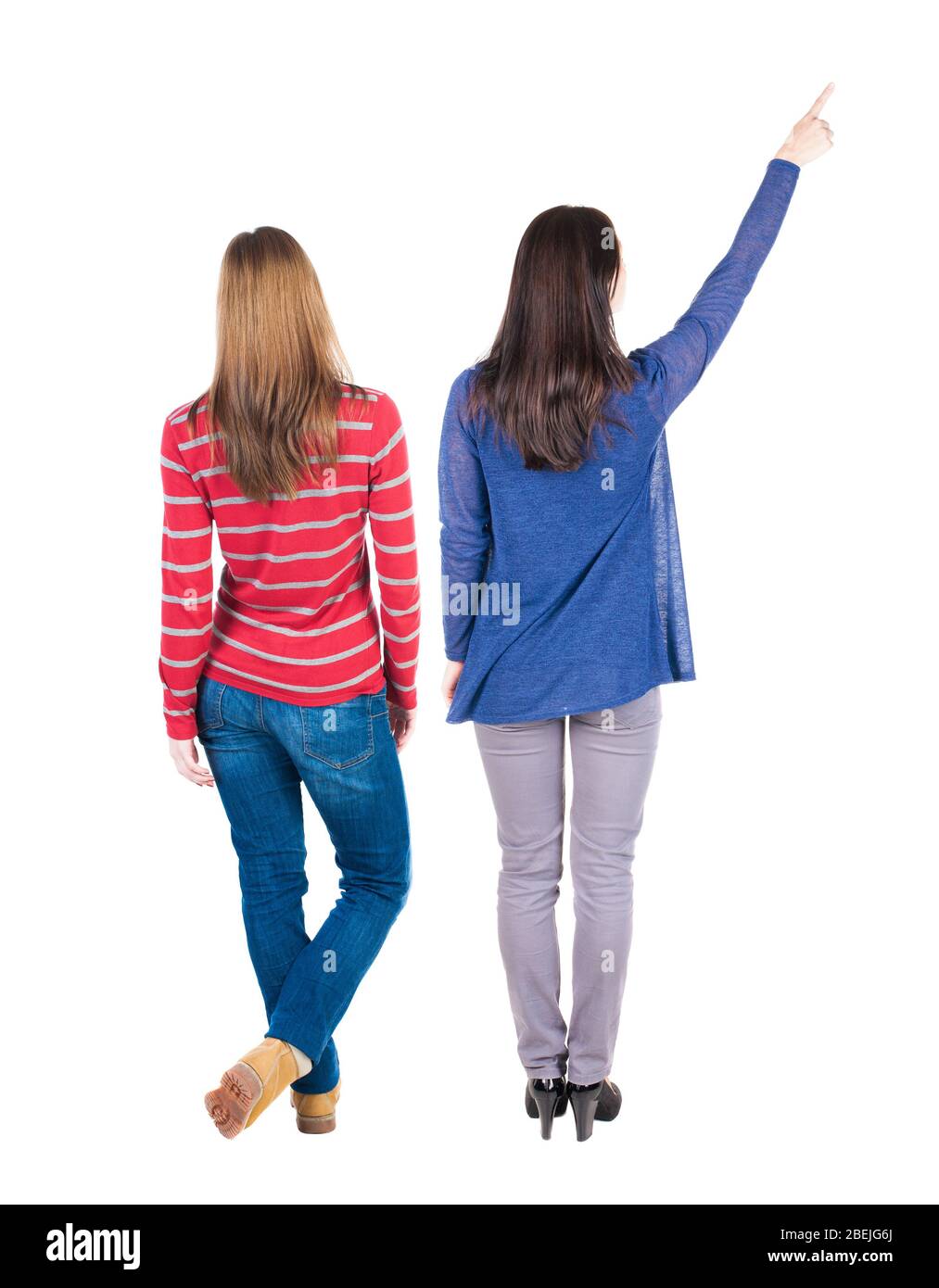 Back view of two pointing girl in sweater. Rear view people collection ...