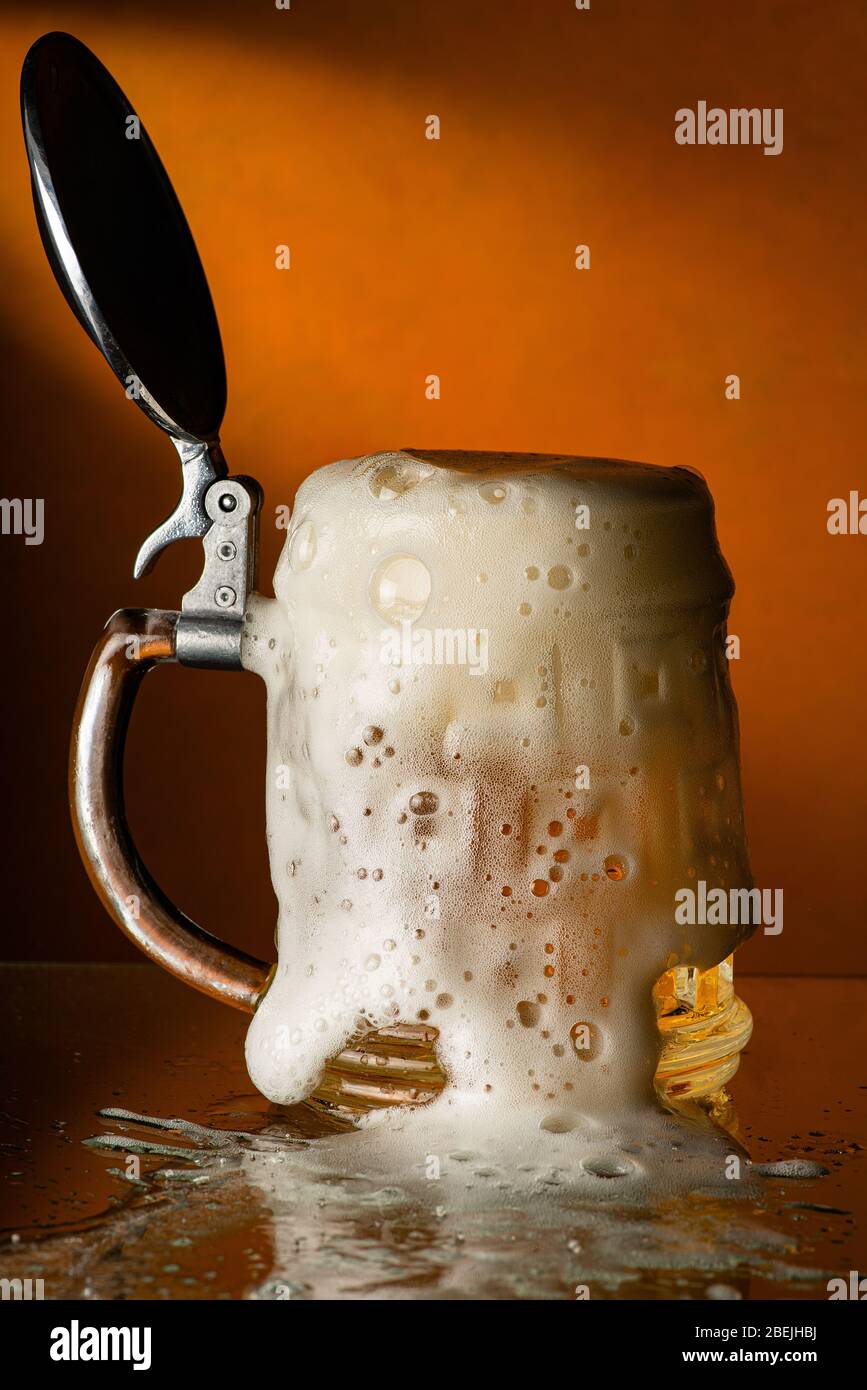 Beer foam overflowing from glass hi-res stock photography and images ...