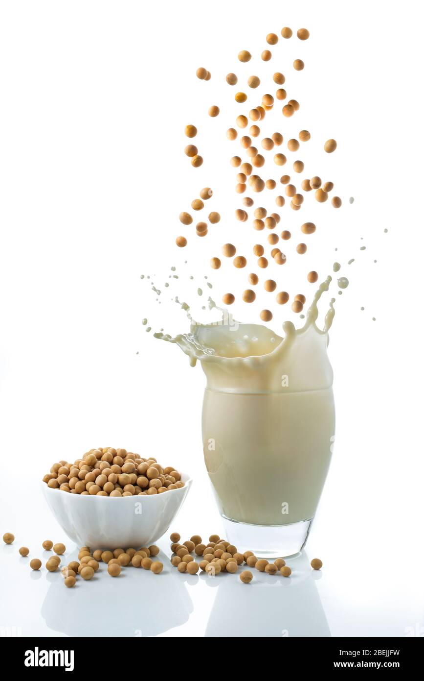 in the glass fresh soy milk with a splash and a waterfall of yellow soy ...