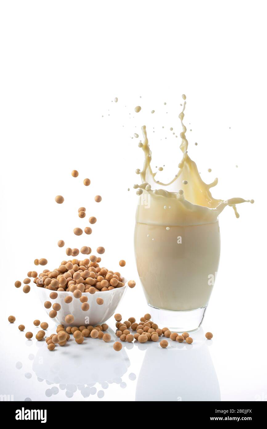 in the glass fresh soy milk with a splash and a waterfall of yellow soy ...