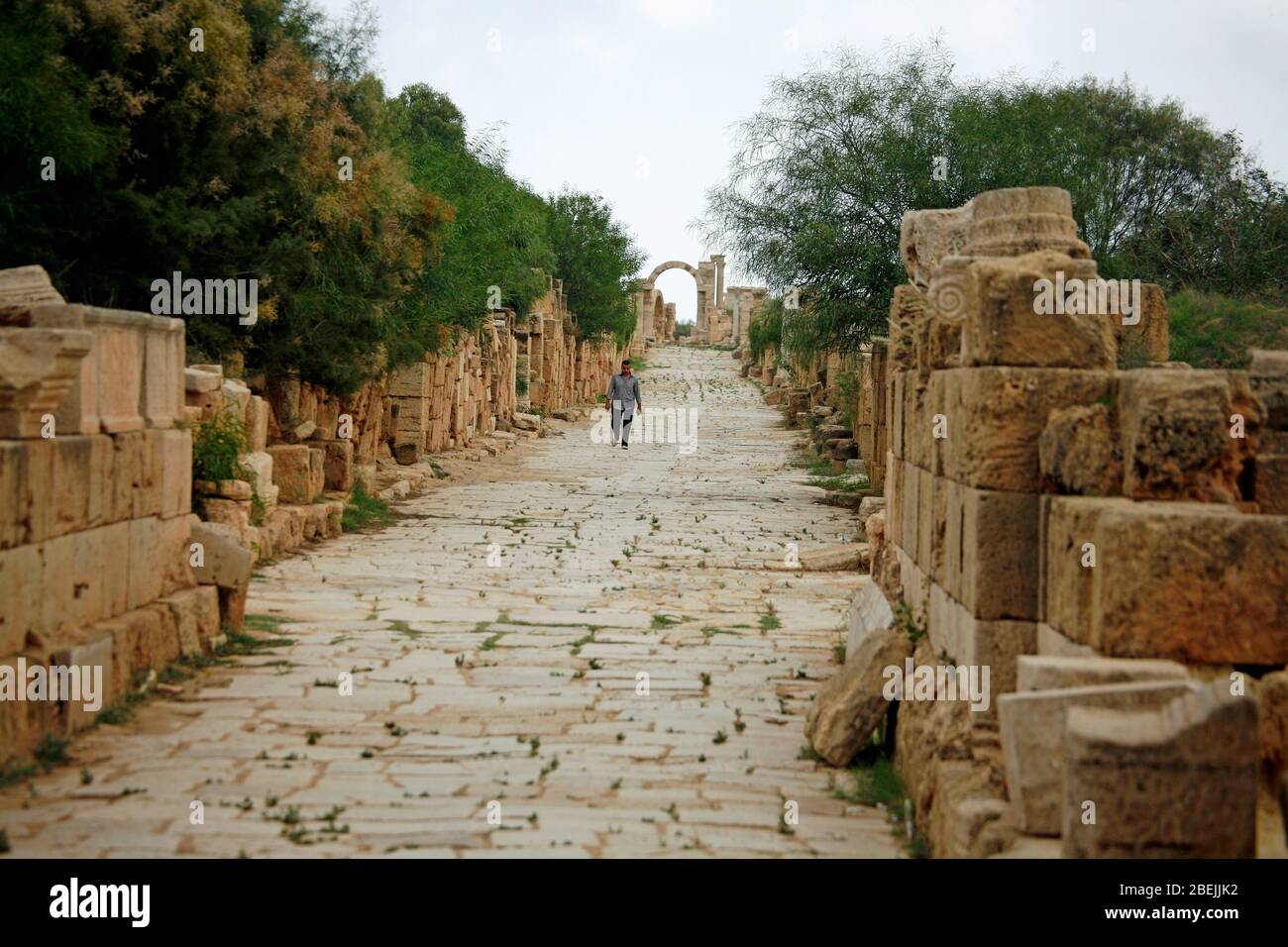 View along an ancient Roman street to the restored four way Arch of ...