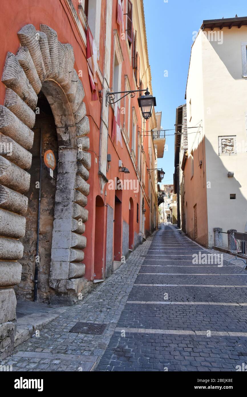 A narrow street between the old houses of Priverno, Italy Stock Photo ...