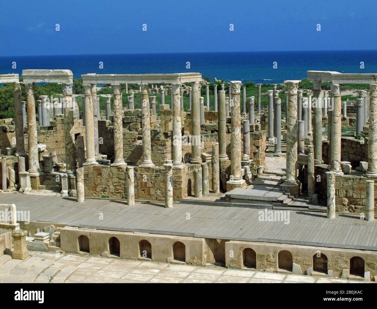 Ancient ruins of Roman theatre at archeological site of Leptis Magna ...