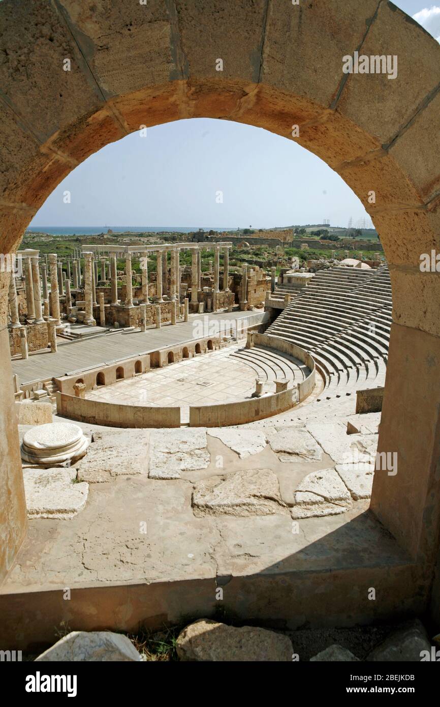 Ancient ruins of Roman theatre at archeological site of Leptis Magna ...