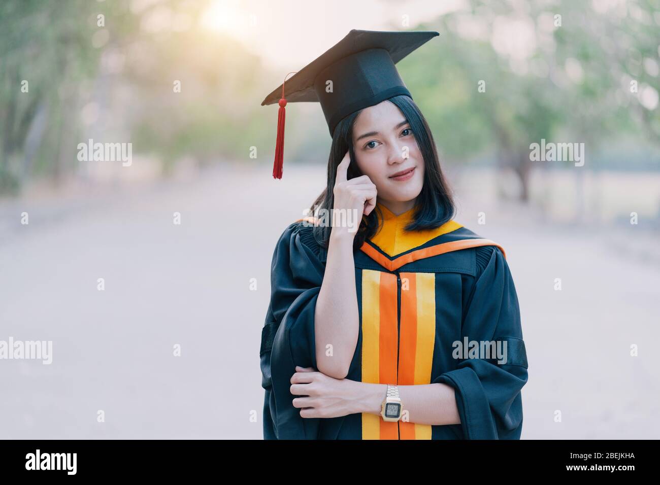 Young charming Asian feemale gradutes cerebrate her degree graduation ...