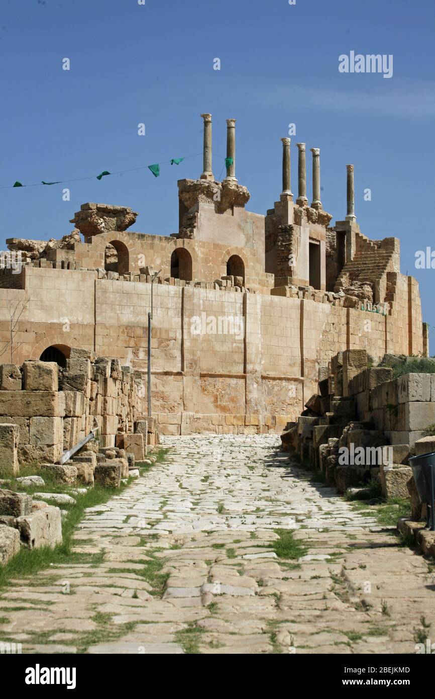 Ancient ruins of Roman theatre at archeological site of Leptis Magna ...