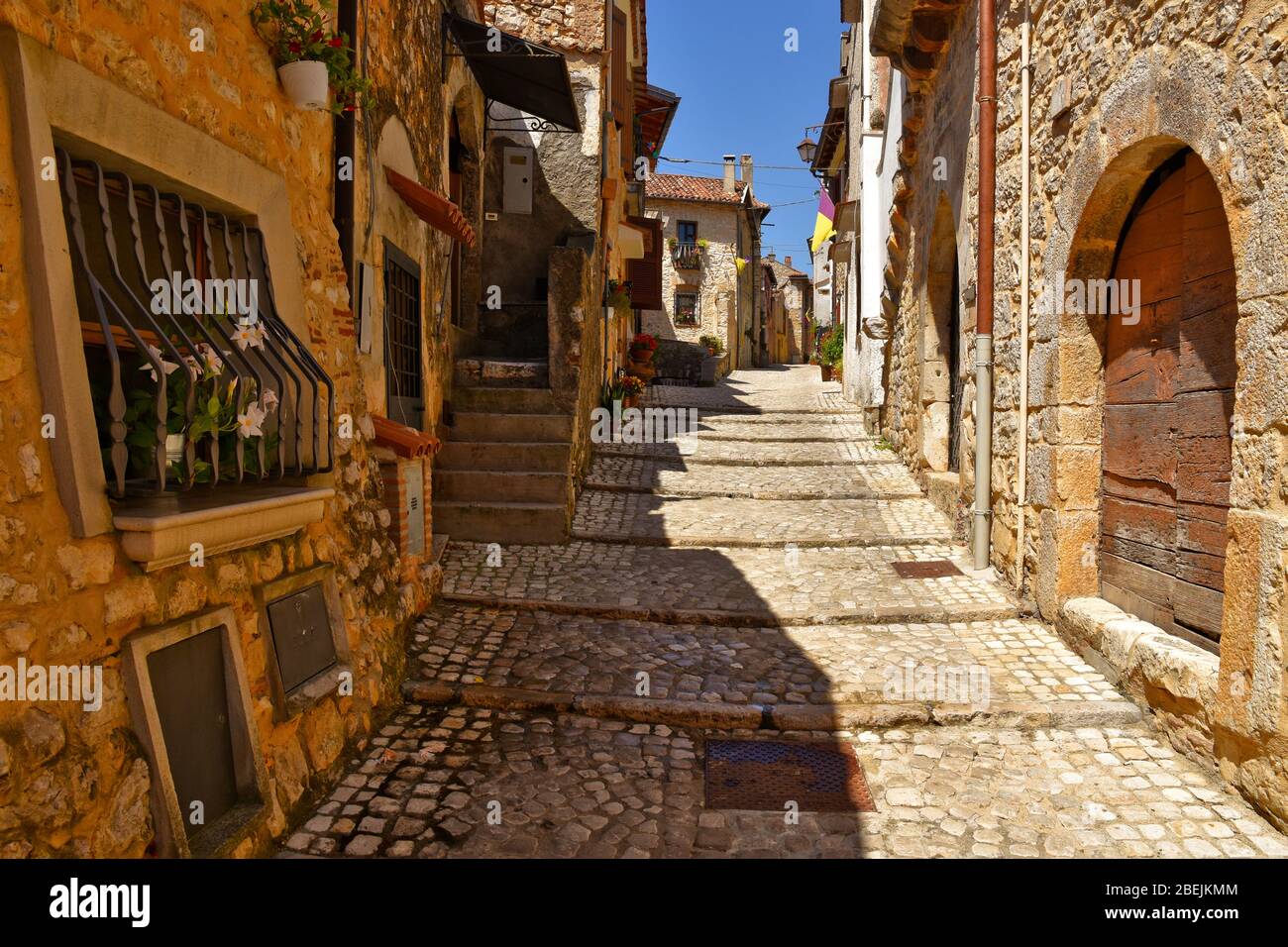 A narrow street between the old houses of Priverno, Italy Stock Photo ...