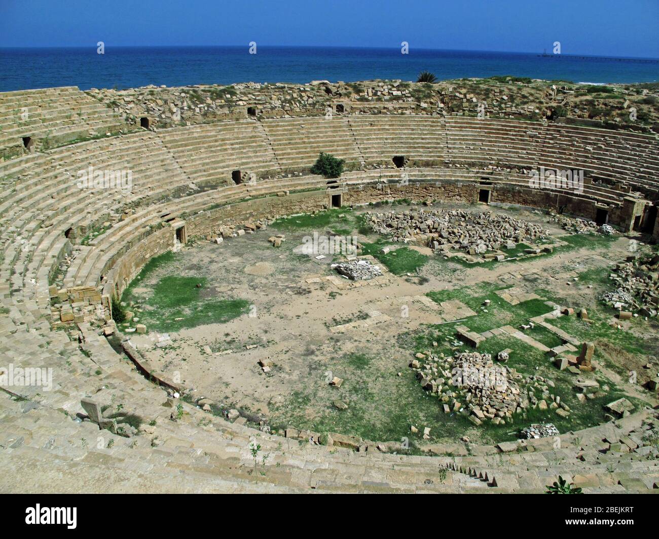 The ruins of Roman Amphitheatre on the Mediterranean seaside at Leptis ...