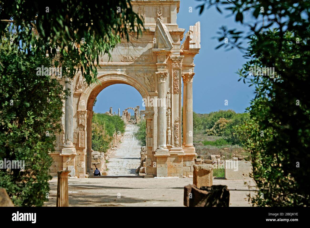 View along an ancient Roman street and the four way Arch of Septimius ...