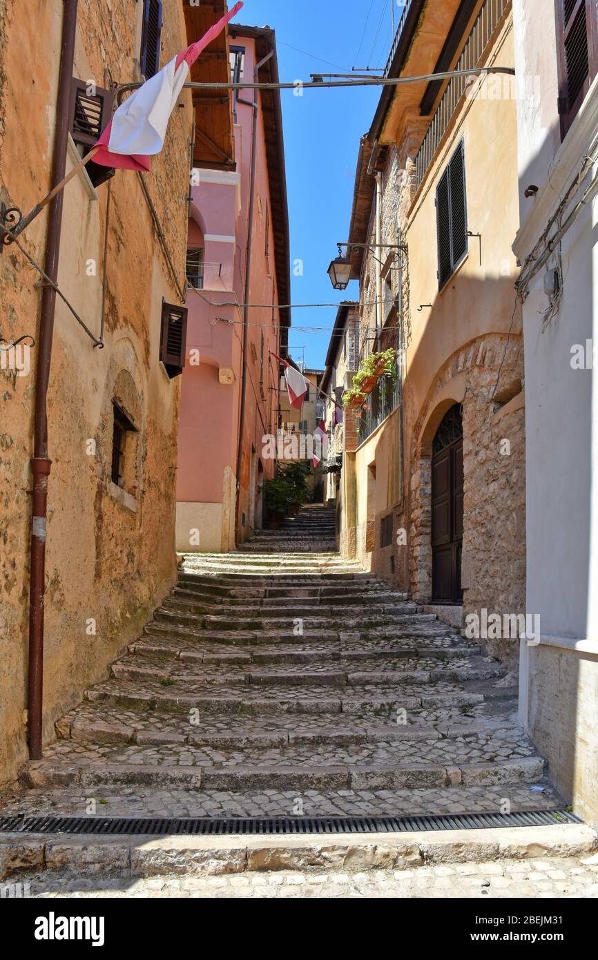 A narrow street between the old houses of Priverno, Italy Stock Photo ...
