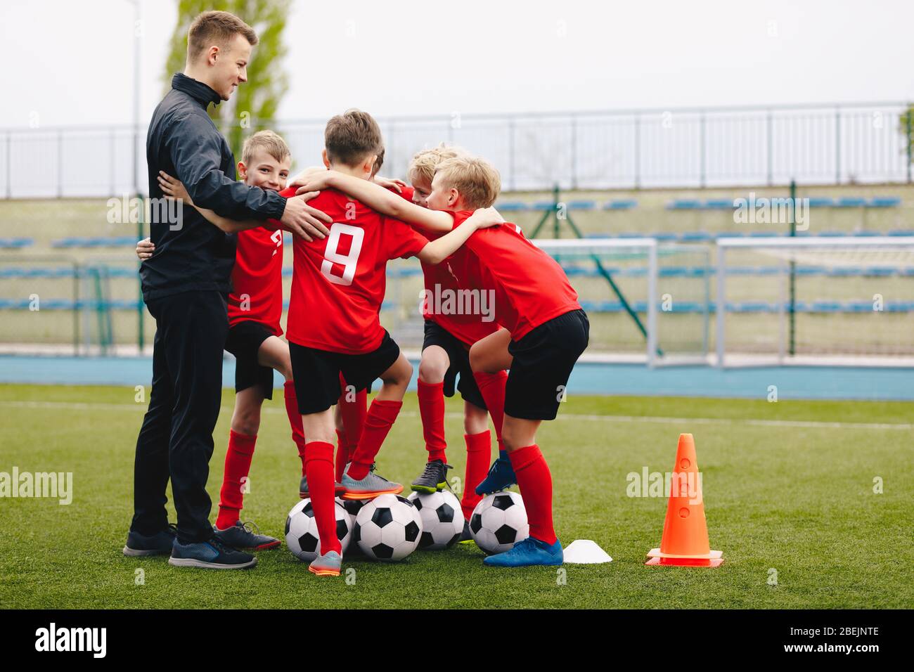 Coach Giving Young Soccer Team Instructions. Kids Sport Team Gathering ...