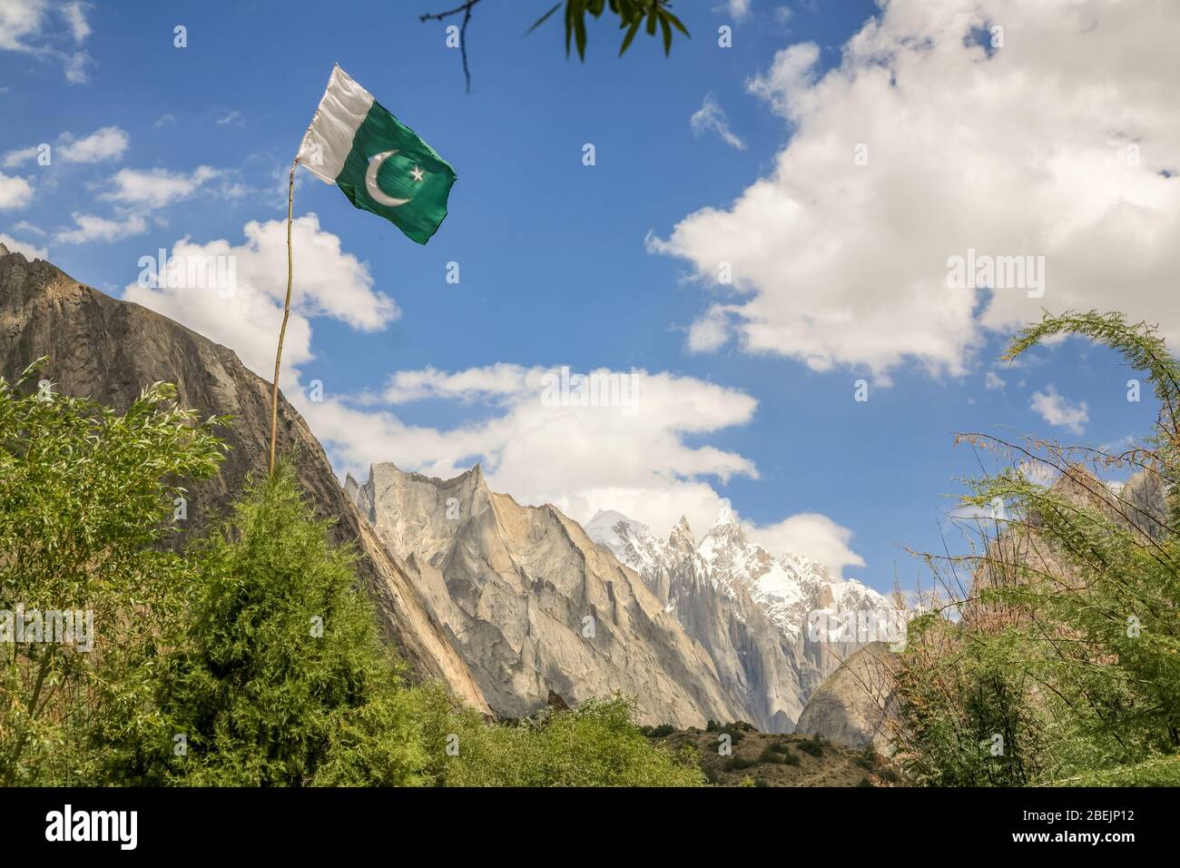 A Pakistan flag flying over a small camp in the Karakoram Mountains in ...