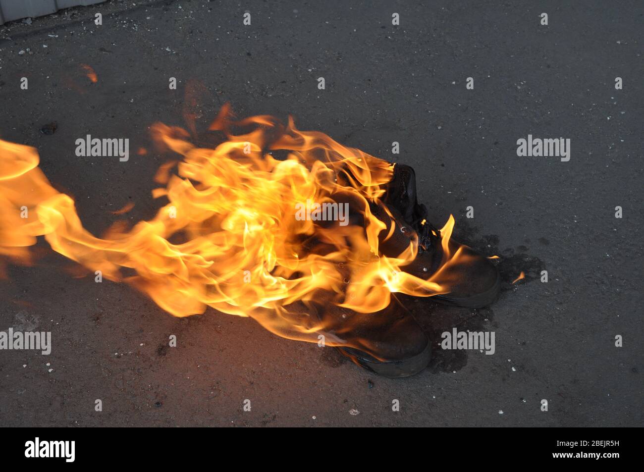 Burning shoes hi-res stock photography and images - Alamy