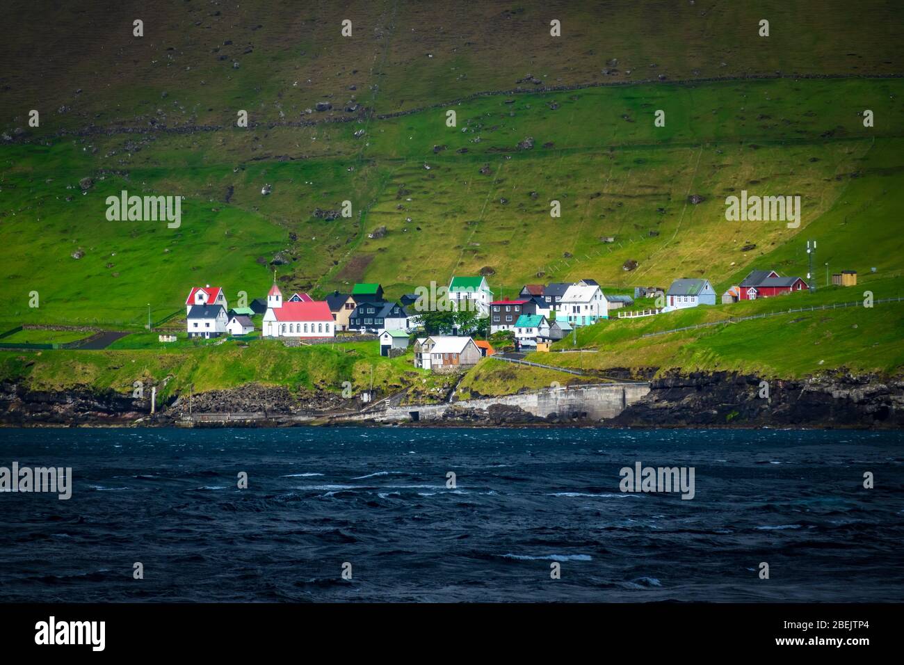 Very small village in Faroe Islands fjord Stock Photo - Alamy