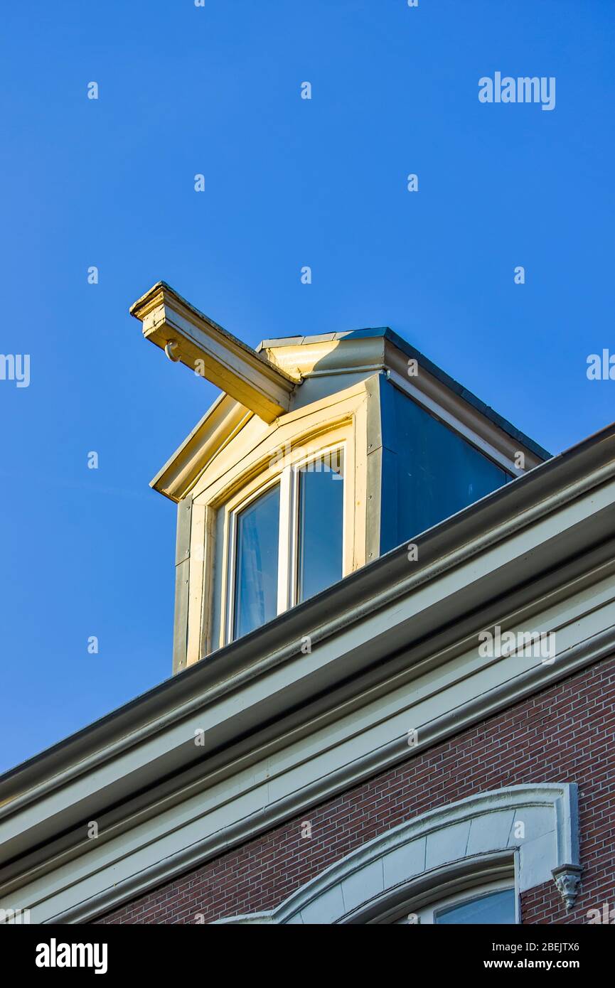 Roof with windows in Amsterdam buildings Stock Photo - Alamy