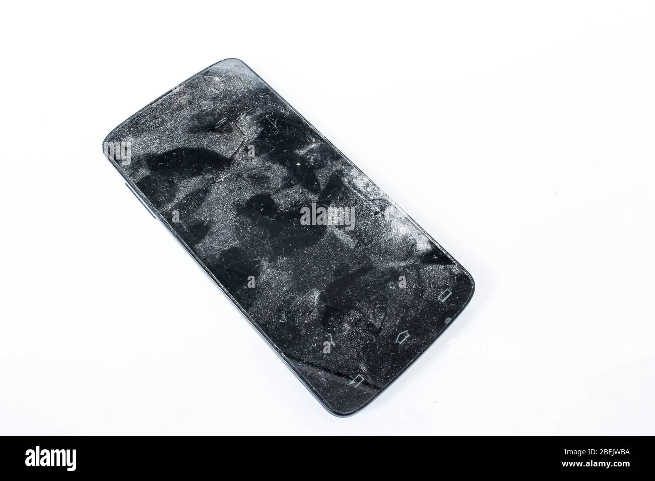 Old broken mobile phone on a white background Stock Photo - Alamy