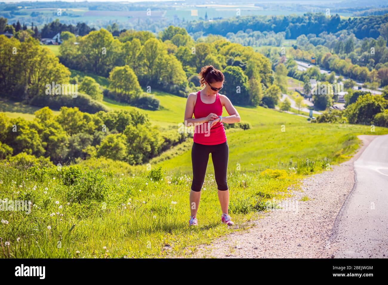 young woman jogging through the rural landscape Stock Photo - Alamy