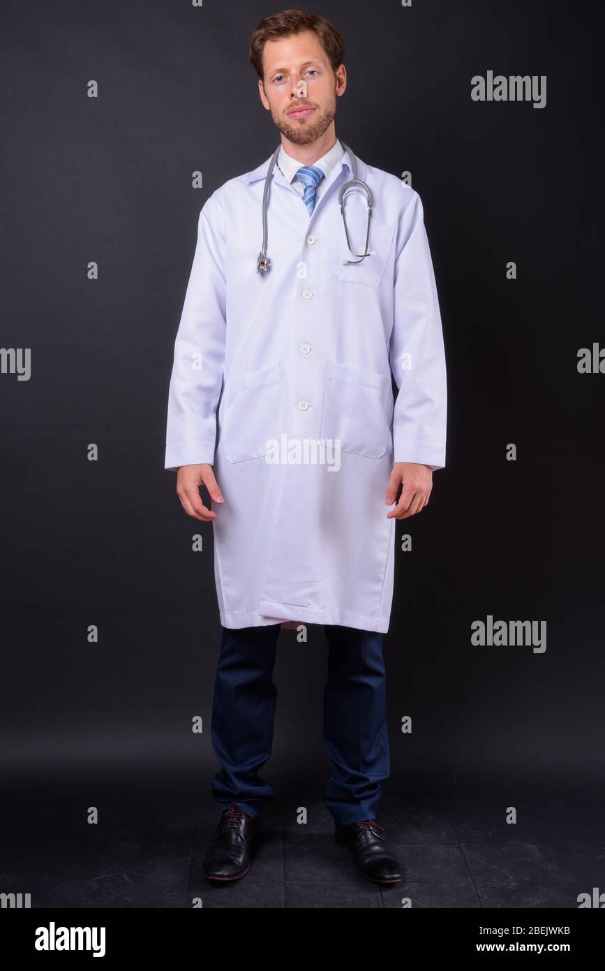 Full body shot of bearded man doctor Stock Photo - Alamy