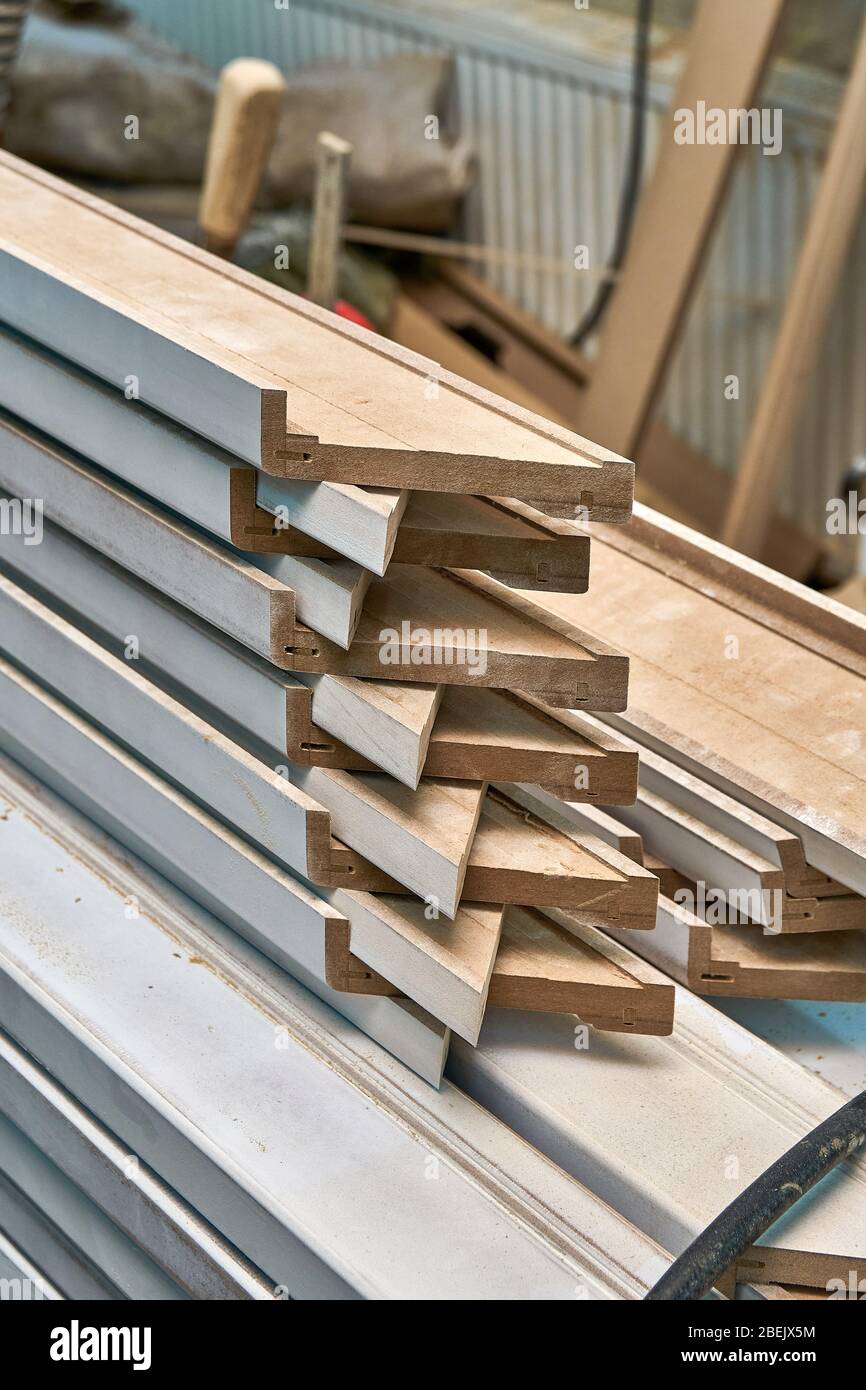 Joinery. Stacked door architraves. Wood door manufacturing process ...