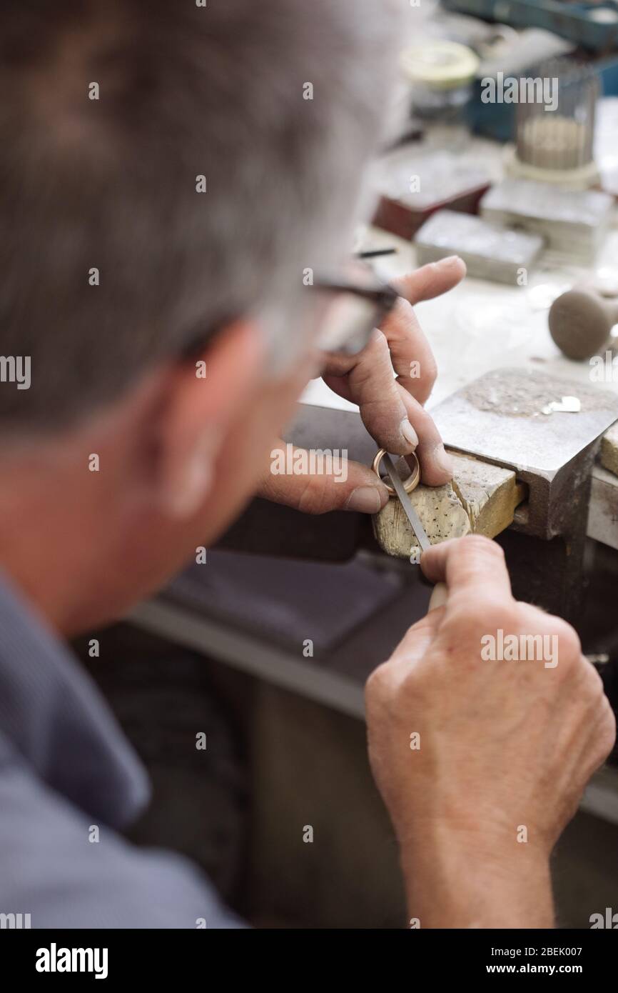 Jeweller working an a ring Stock Photo - Alamy