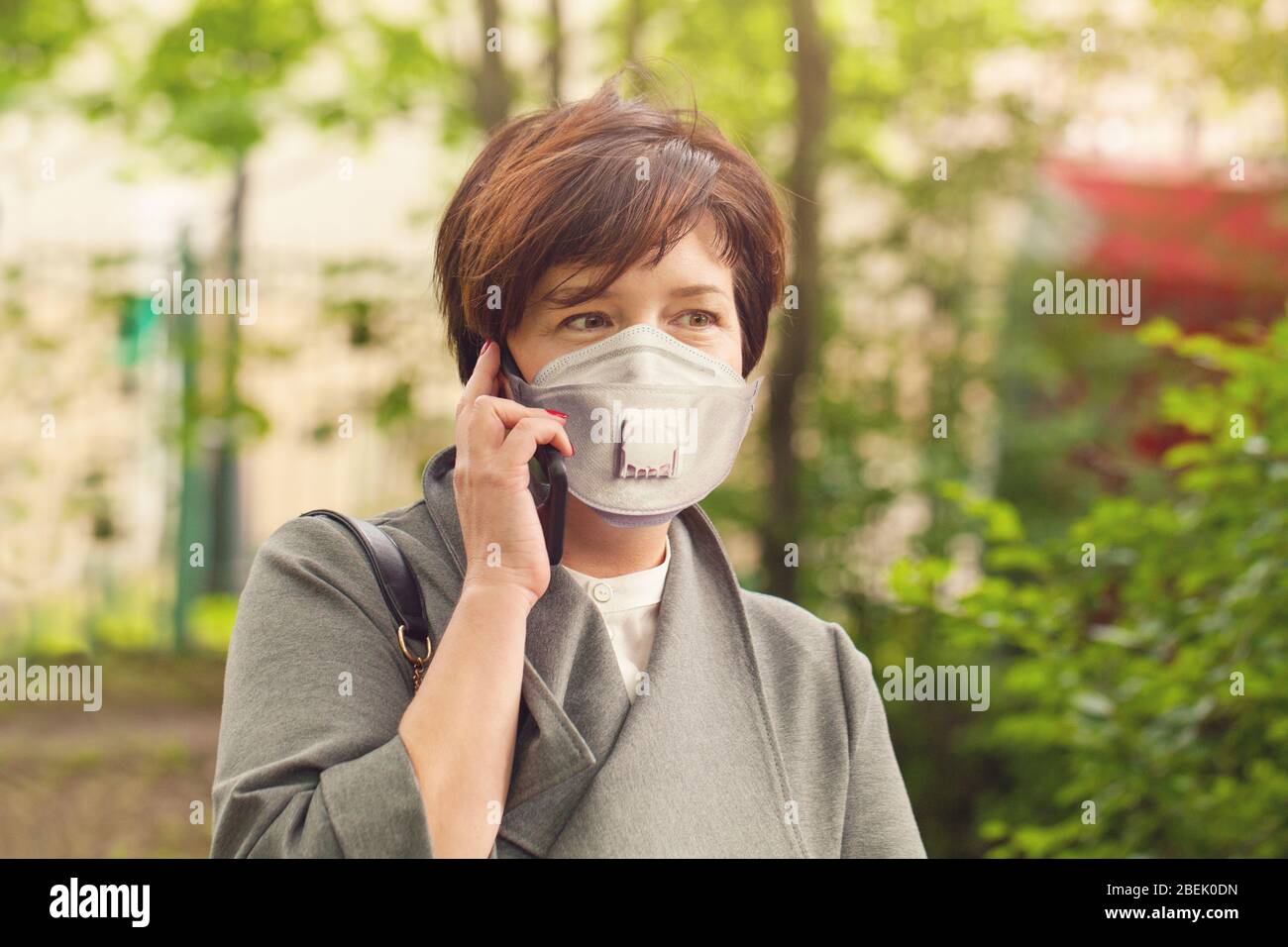 Mature woman in medical mask hi-res stock photography and images - Alamy