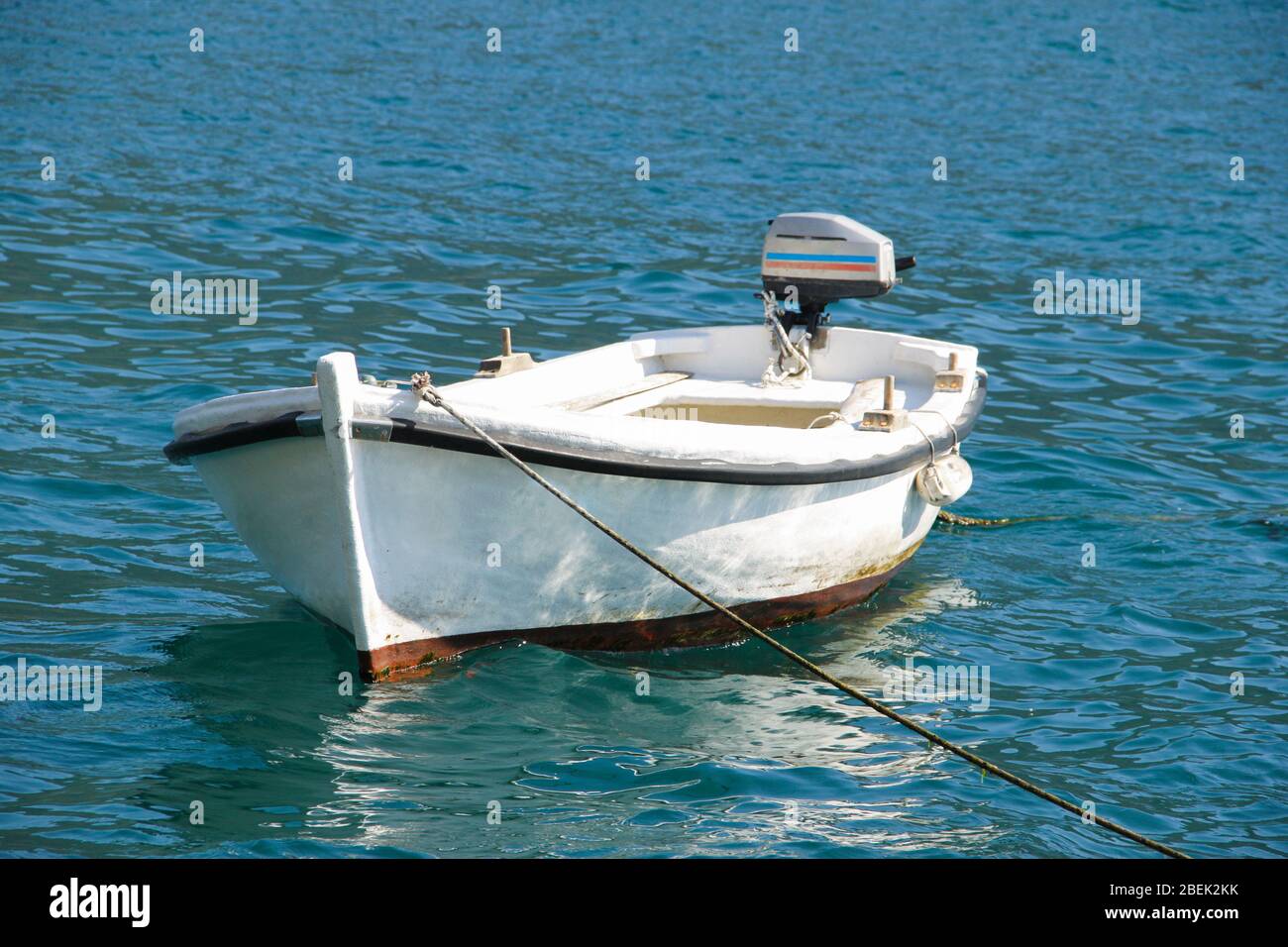 Small sea boat anchored in the Boka bay in beautiful sea Stock Photo ...