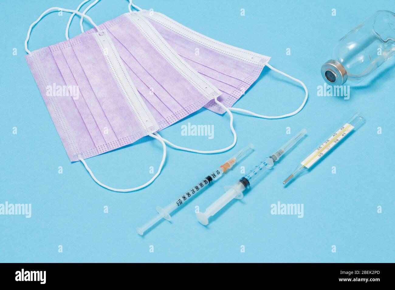 Medical masks, syringes for injection and a glass mercury thermometer ...