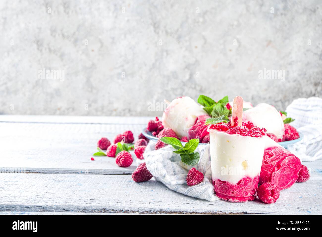 Sweet and tasty diet summer dessert. Homemade raspberry yogurt popsicle ...