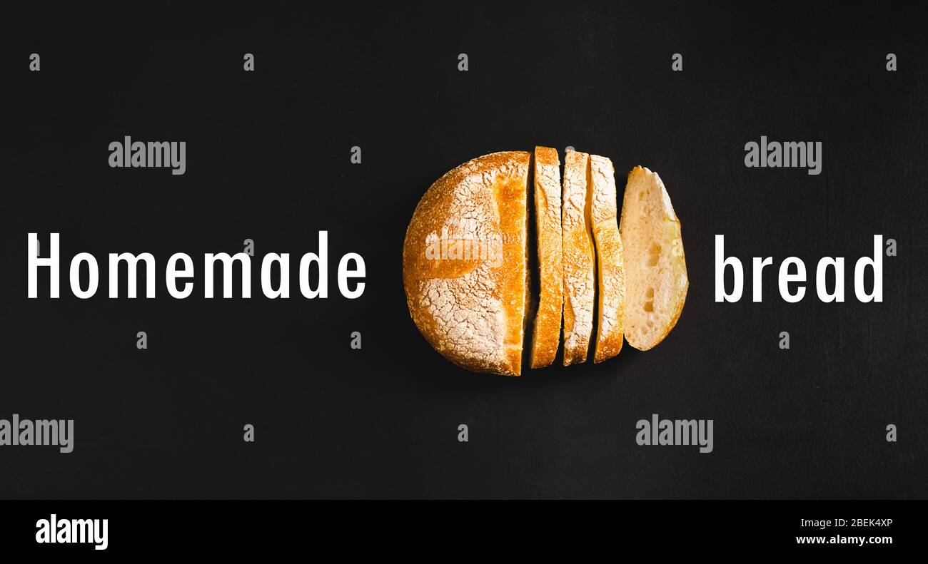 Fresh bread with a crispy golden crust on a black background text ...