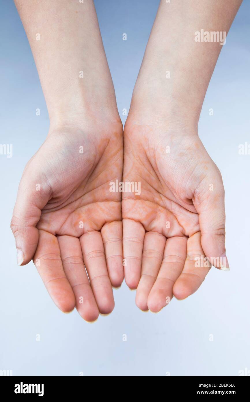 Close up of hands on a plain background Stock Photo - Alamy