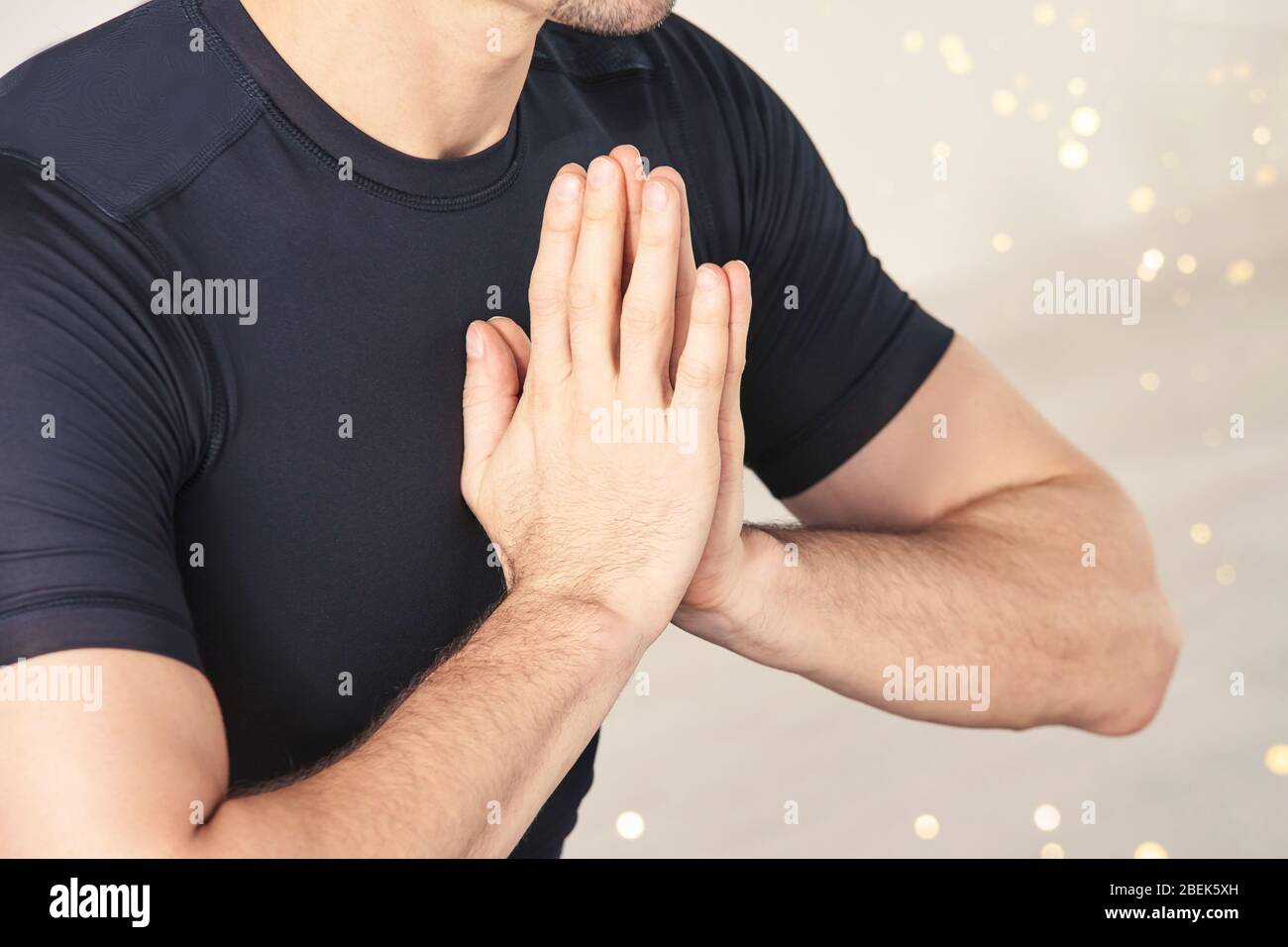 Yoga man hands. Namaste arm position. Gym studio Stock Photo - Alamy