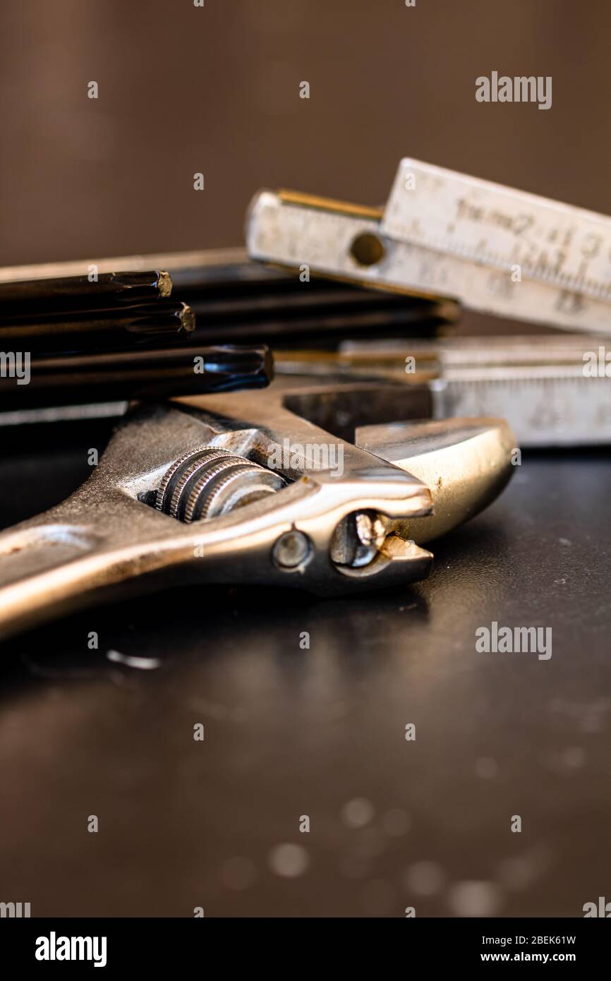 Tools for repair and building. Adjustable spanner, ruler and ...
