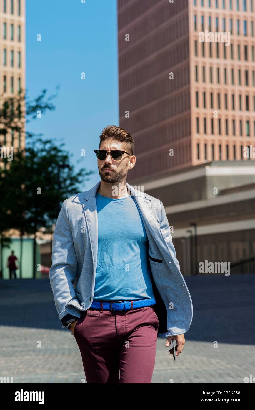 Portrait Of A Young Bearded Man With Sunglasses Model Of Fashion In