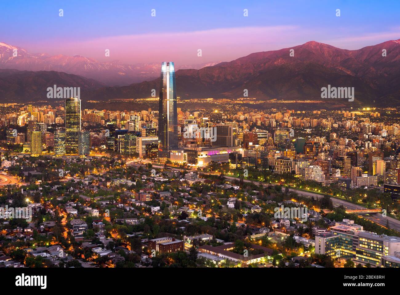 Panoramic view at dusk of Santiago de Chile with The Andes Mountain ...