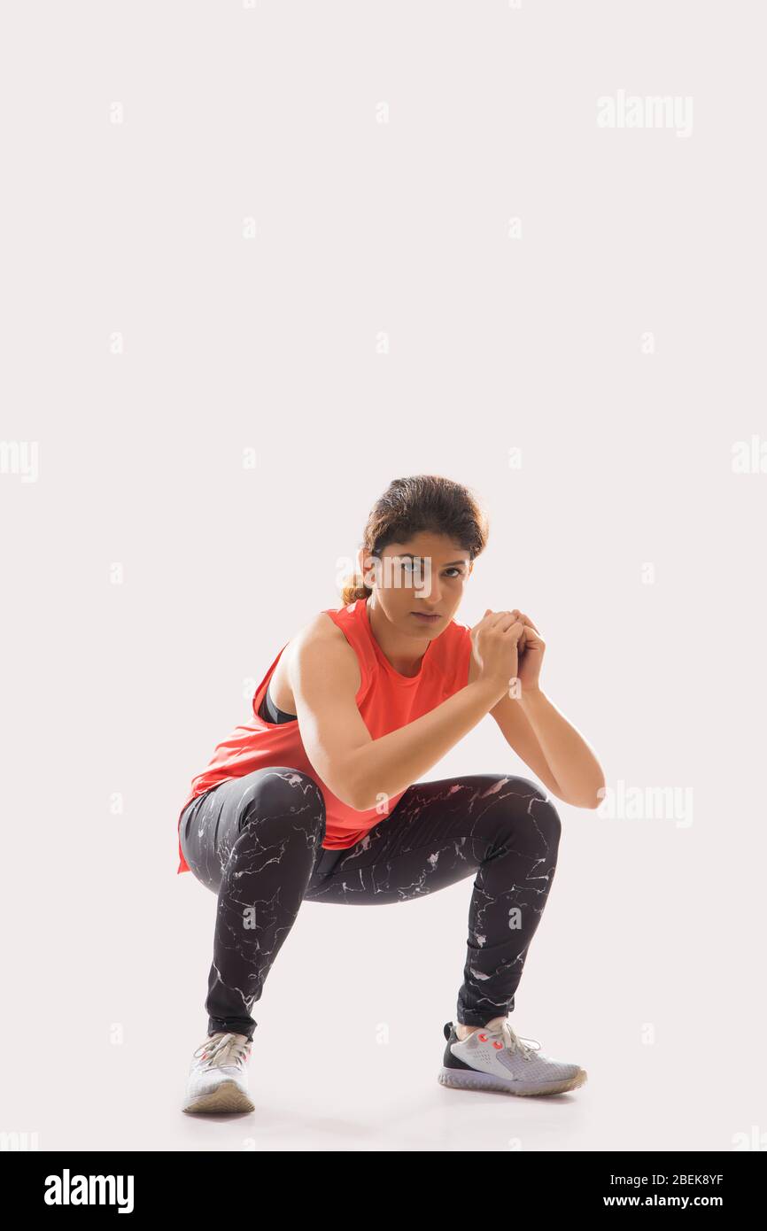 Indian woman squatting hi-res stock photography and images - Alamy