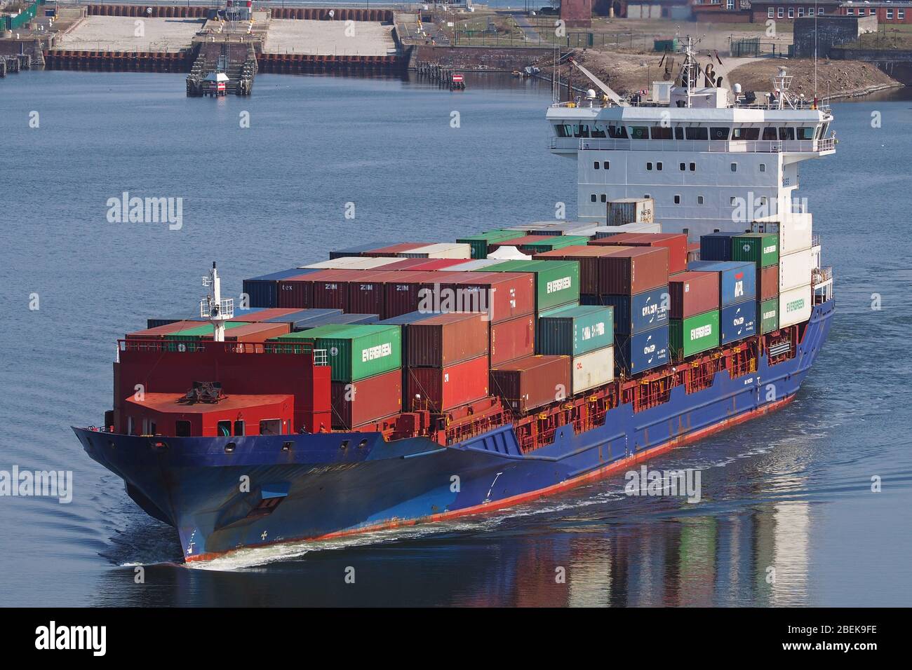 Feedervessel Perseus passing the Kiel Canal Stock Photo - Alamy