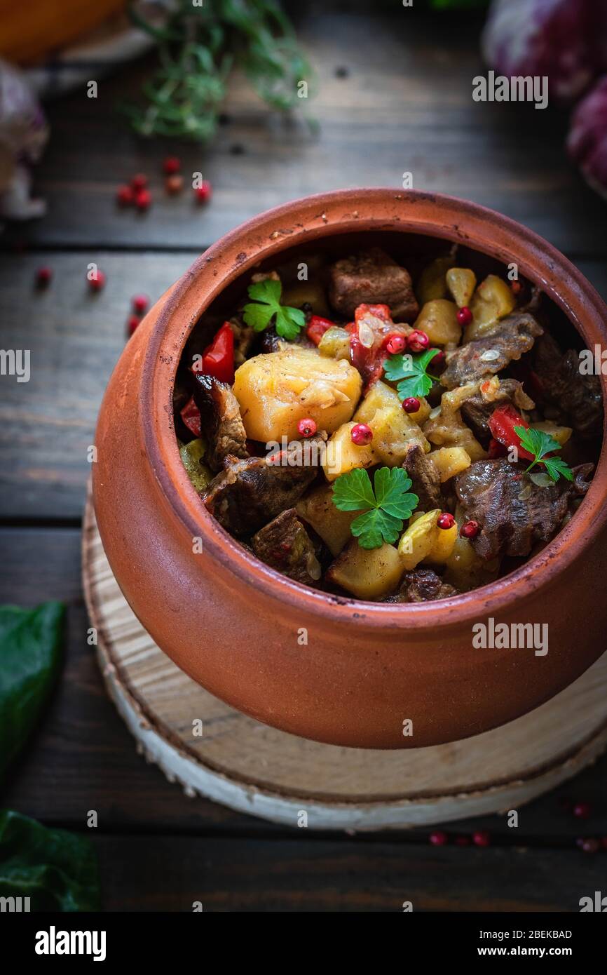 Roast in a clay pot in a rustic style. Braised beef with vegetables ...