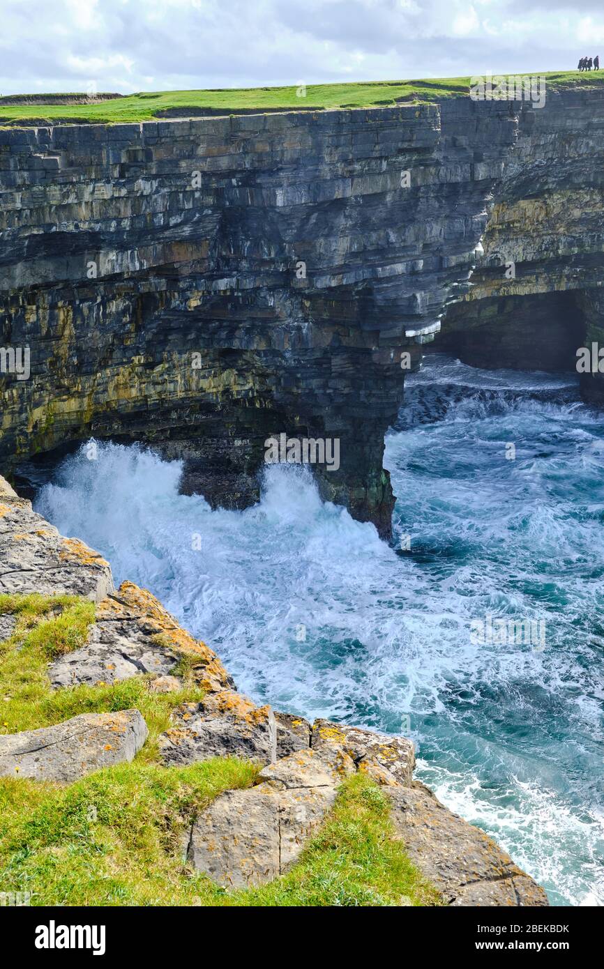 The famous cliff overlooking the sea at Downpatrick Head, Knockaun ...