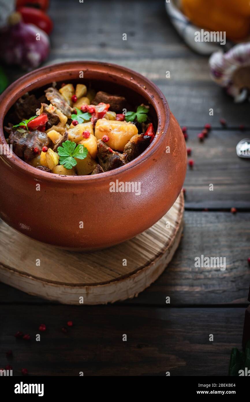 Roast in a clay pot in a rustic style. Braised beef with vegetables ...