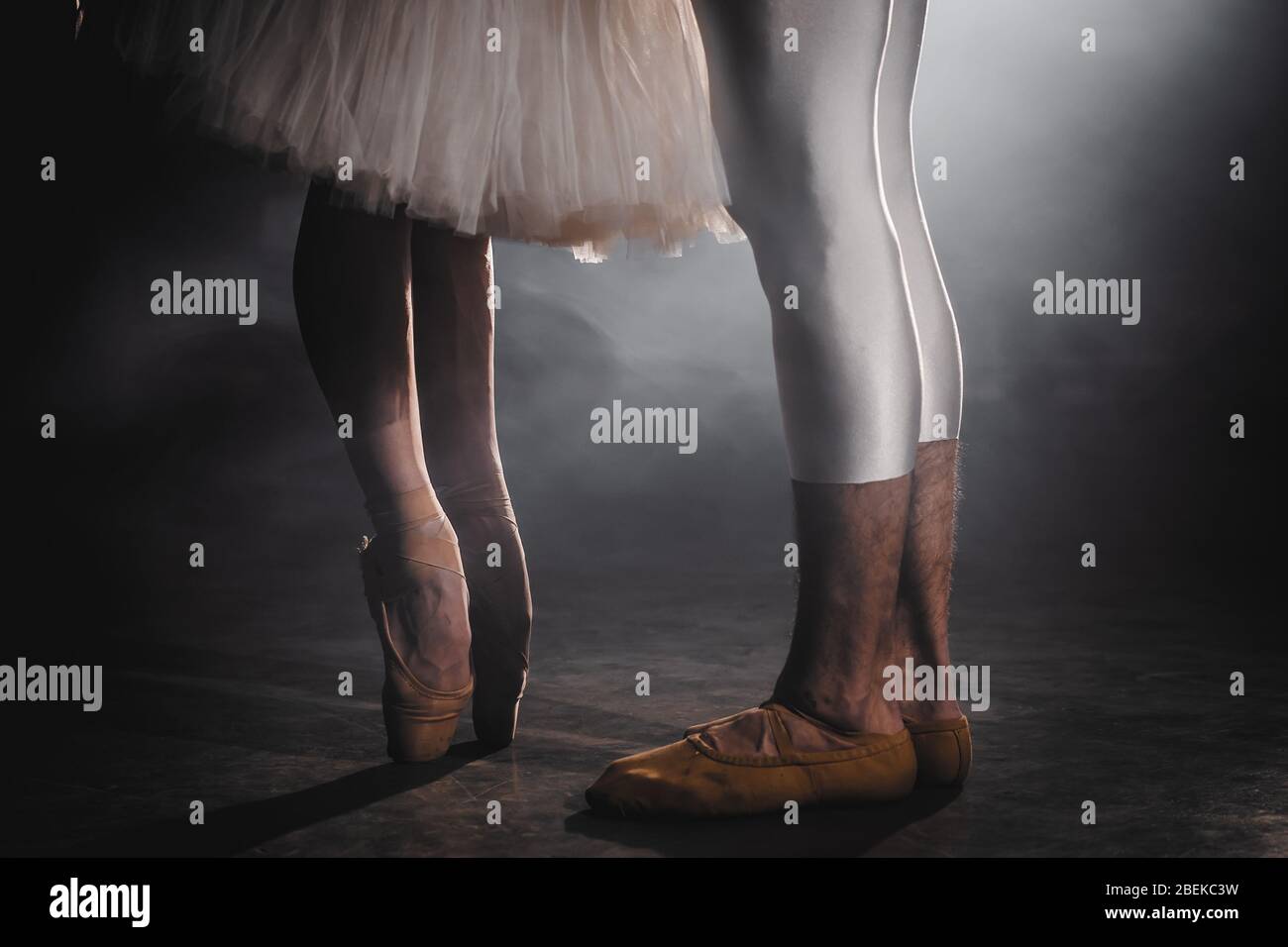 Close up of ballet couple of dancers as they practices exercises on ...