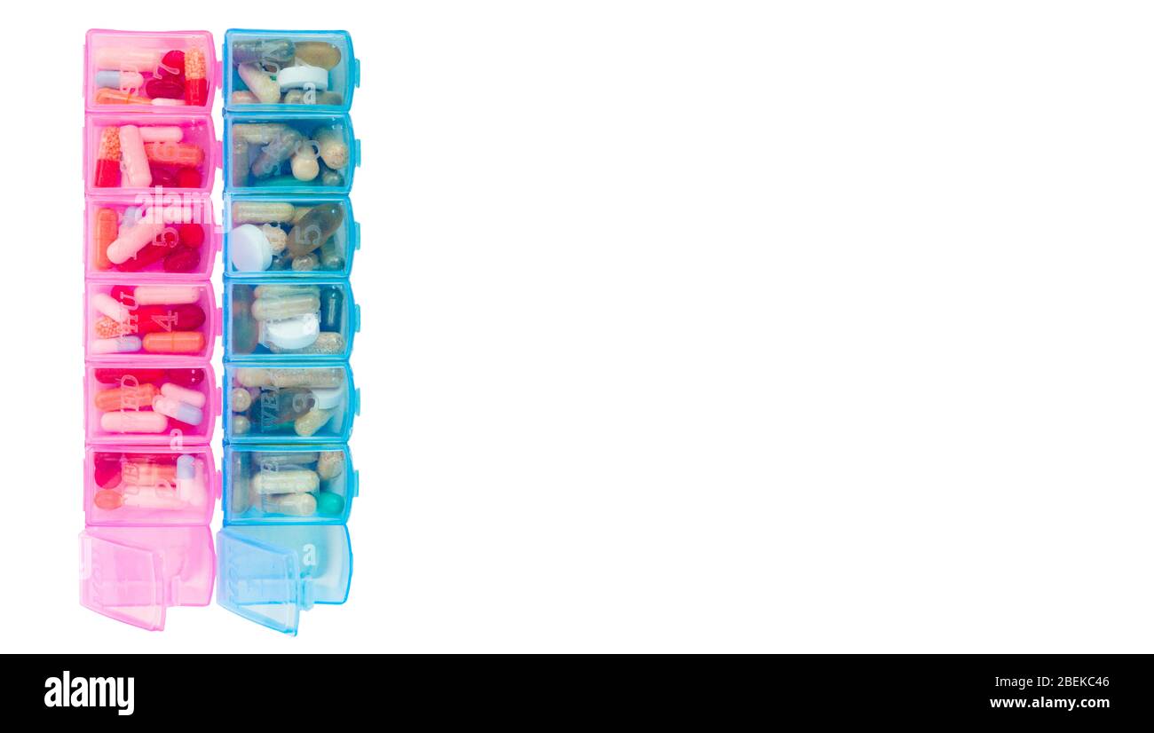 Pill boxes with tablets isolated on white background. Treatment concept ...