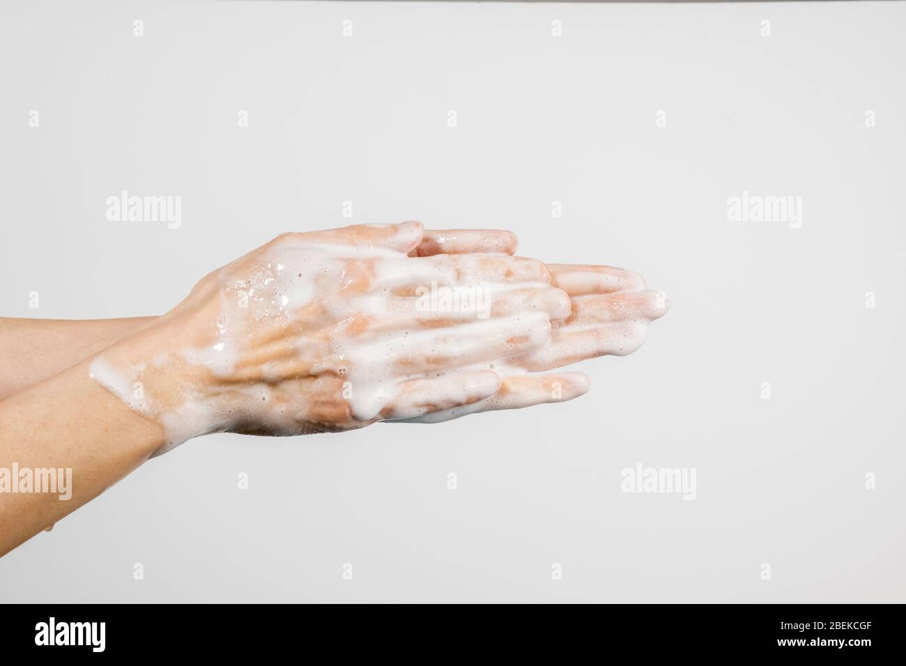 Close up of Caucasian woman washing her hands isolated on white ...