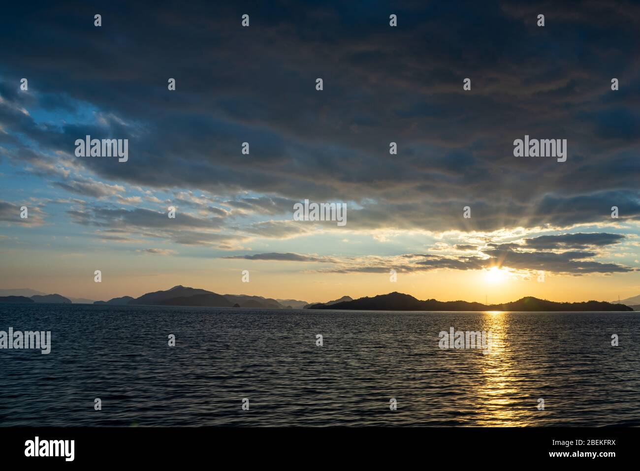 Sunset time in the Seto Inland Sea, Japan. Golden reflection on ocean ...