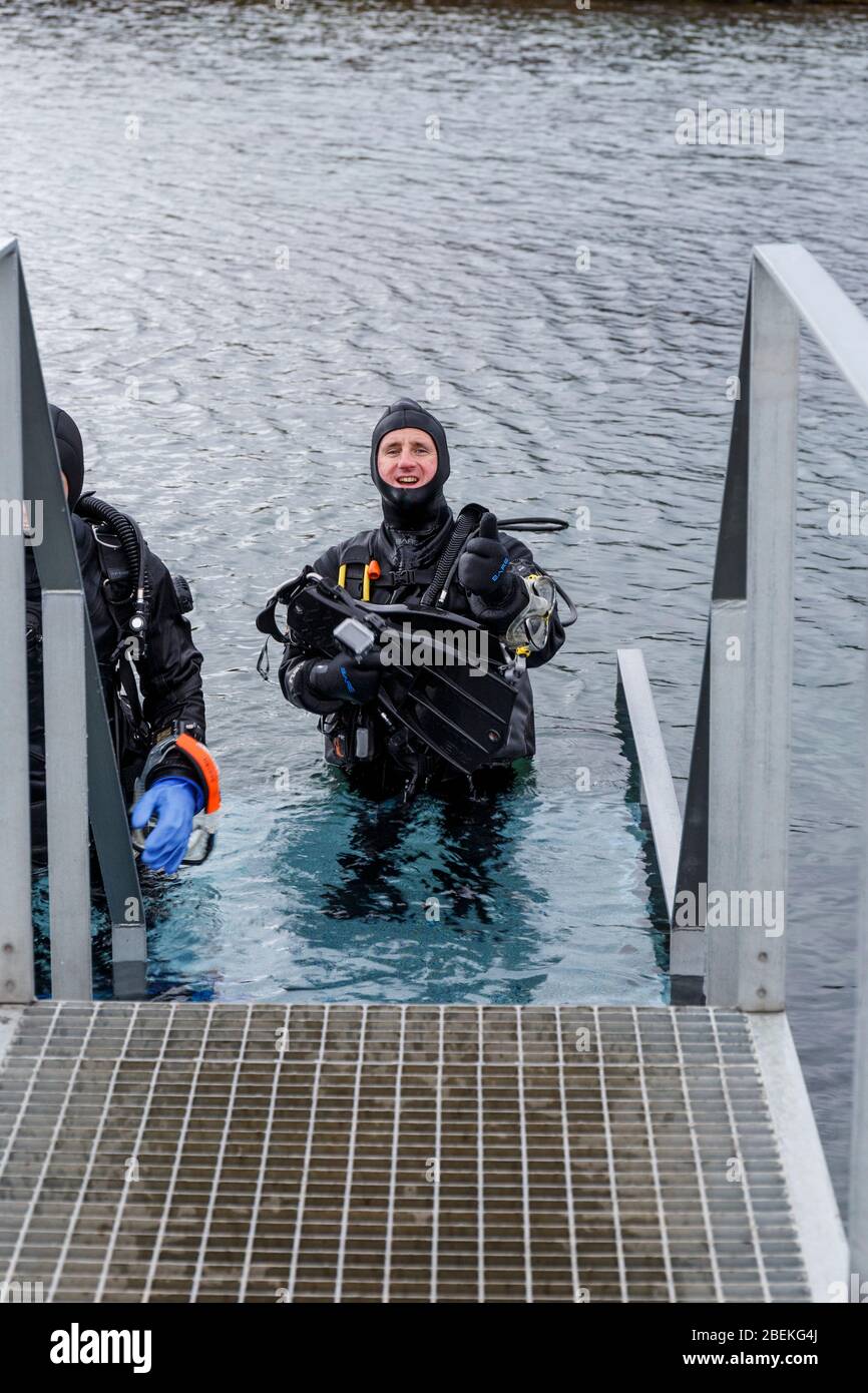 Scuba divers at Silfra rift, the place where Eurasian and the American ...