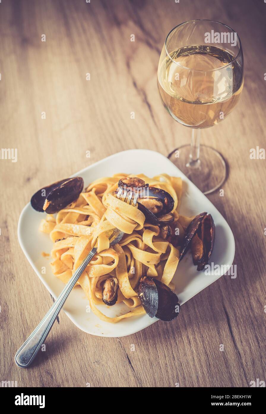 italian tagliatelle on vintage wooden background Stock Photo - Alamy