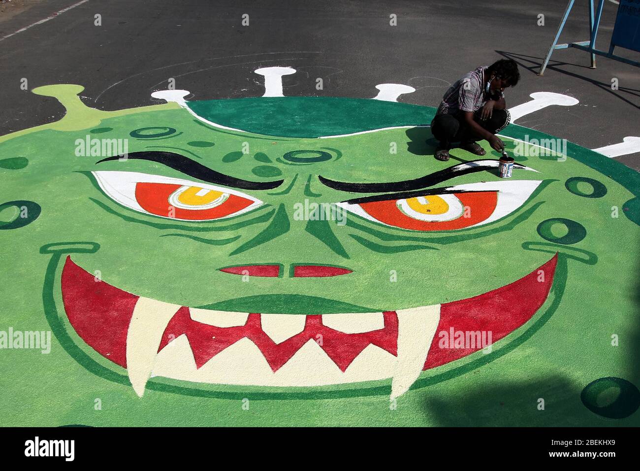 Chennai, India. 12th Apr, 2020. Artist who draws a graffiti painting on ...