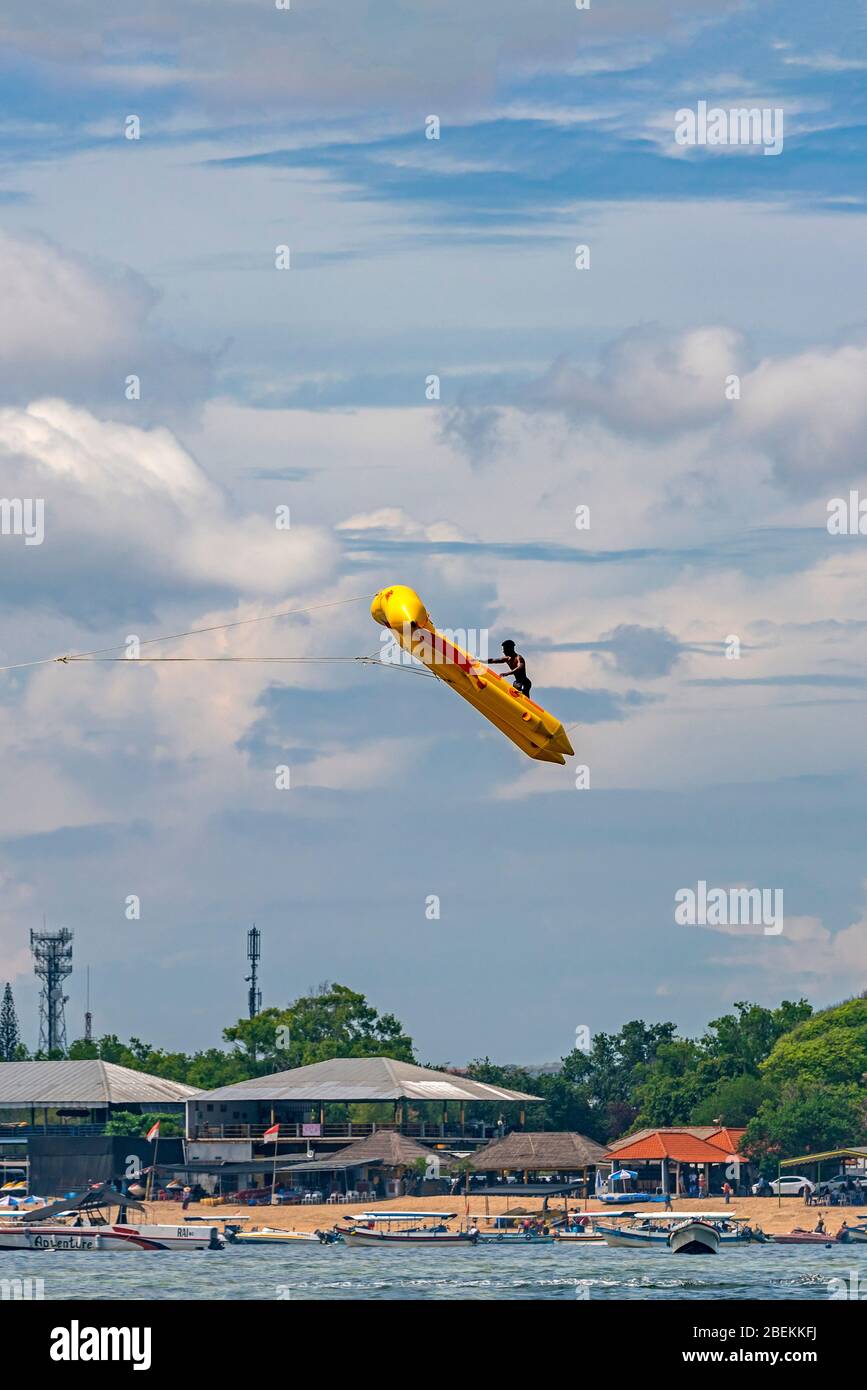 Vertical view of a flying fish ride taking off in Bali, Indonesia Stock ...