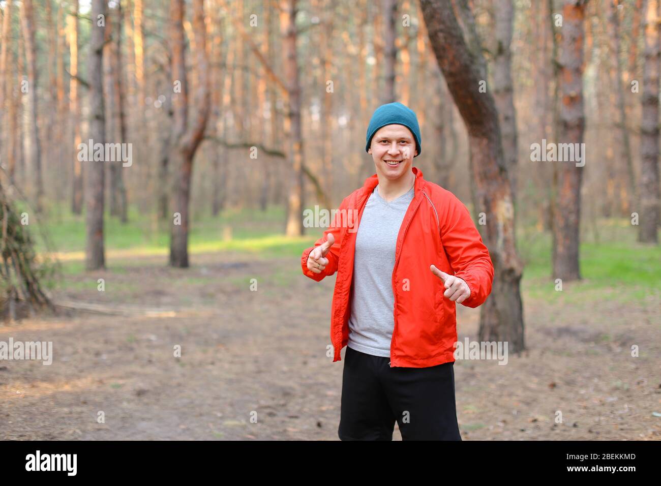 Young man running in park at morning Stock Photo - Alamy