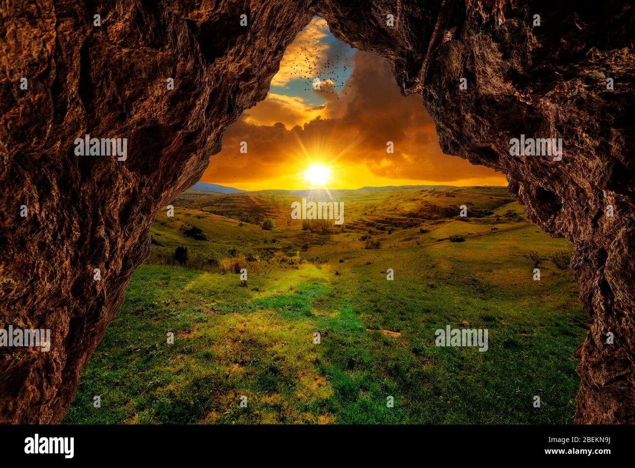 Sunset on the mountain from a cave, montage Stock Photo - Alamy