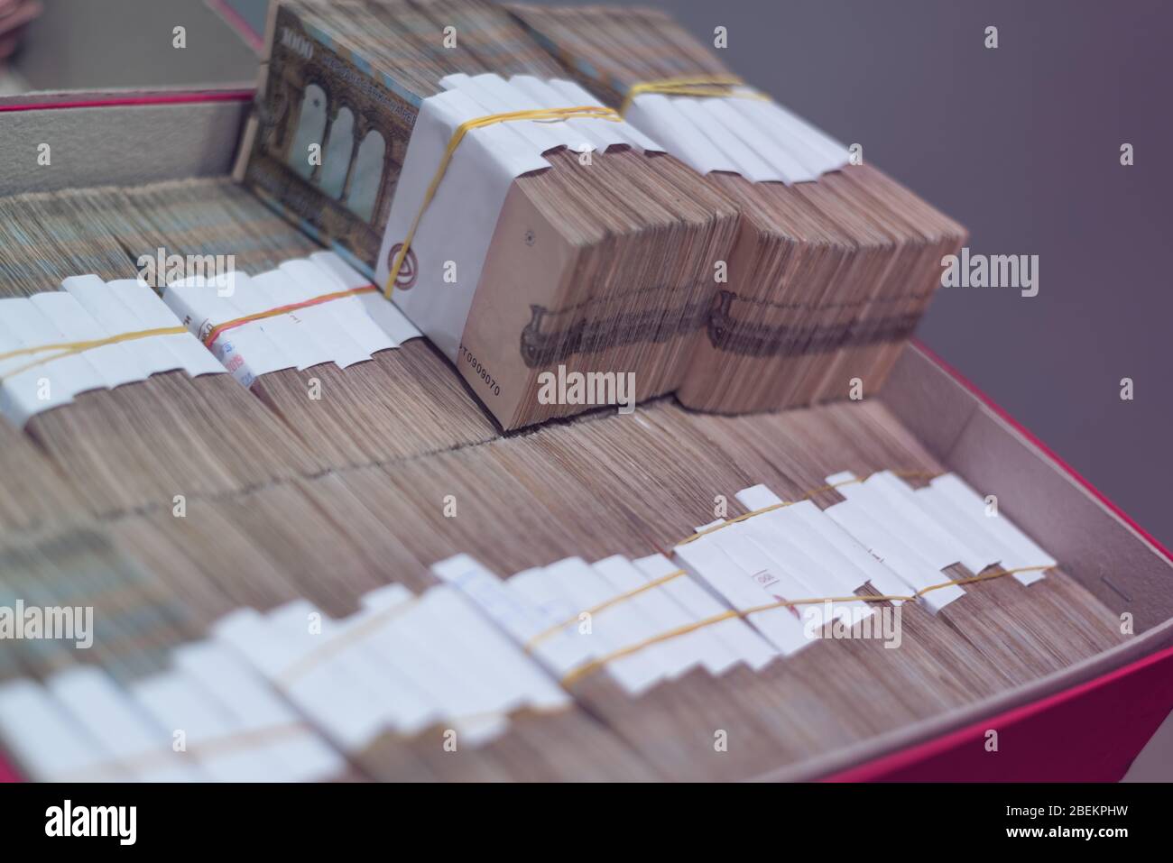 Carton boxes filled with sorted money and stored in a cage in the ...